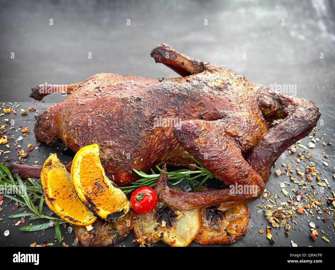 Roasted duck in a smoker grill on dark background. Copy space Stock ...