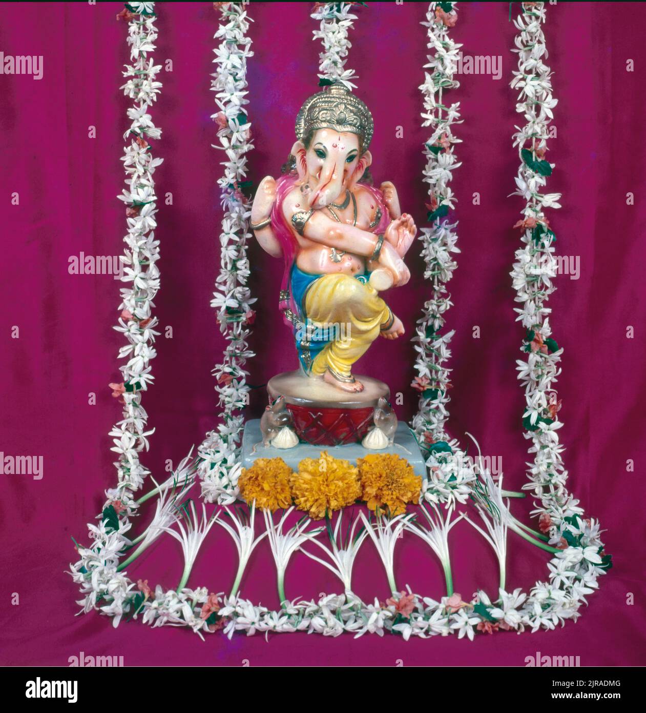 Ganpati with floral decoration Stock Photo - Alamy