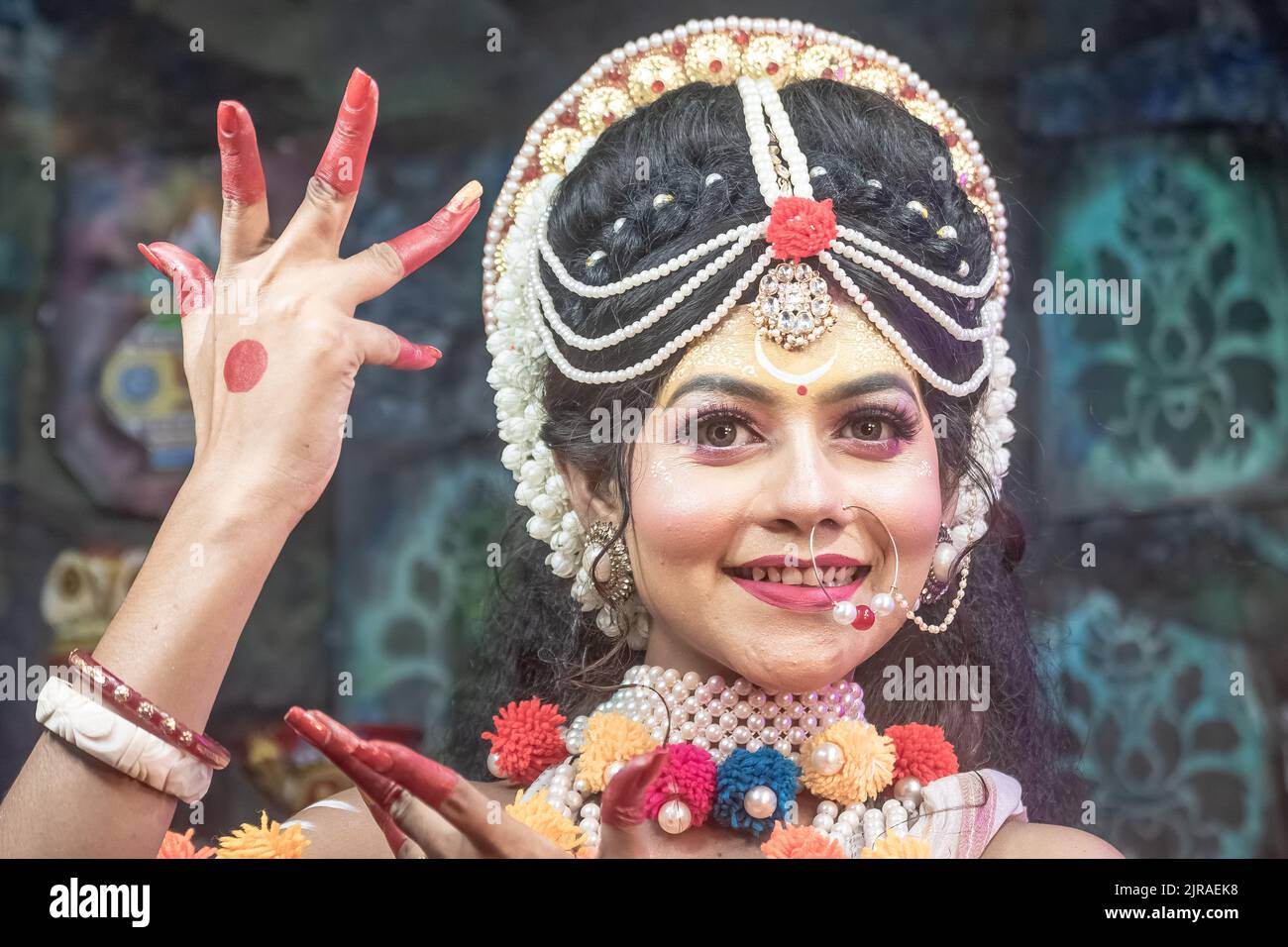 Concept Agomoni shoot with black haired Indian brunette woman face with ...