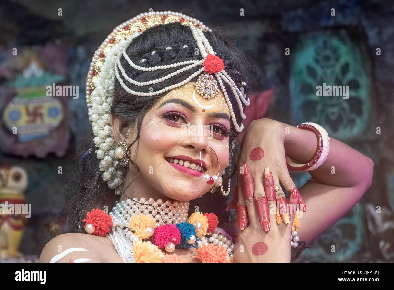 Concept Agomoni shoot with black haired Indian brunette woman face with ...