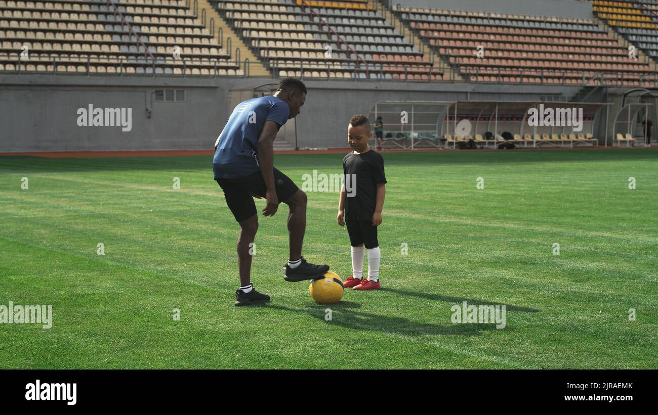 Pan around view of mixed race child running around African American ...
