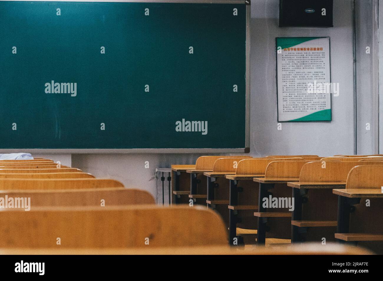 Empty modern classroom with big green blackboard Stock Photo - Alamy