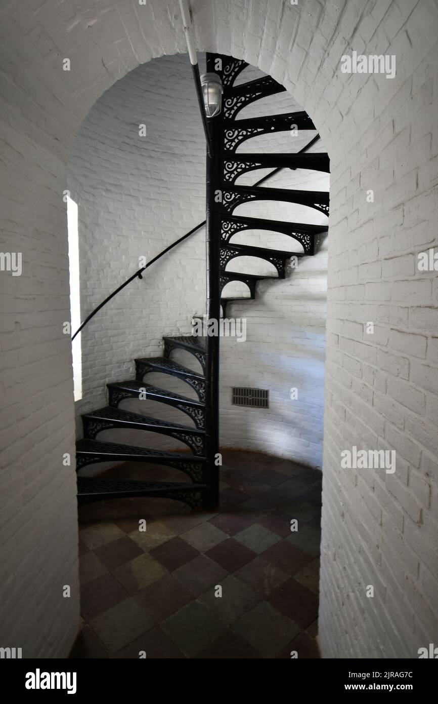 The Cast iron staircase inside the Erie Land Lighthouse, vertical shot ...