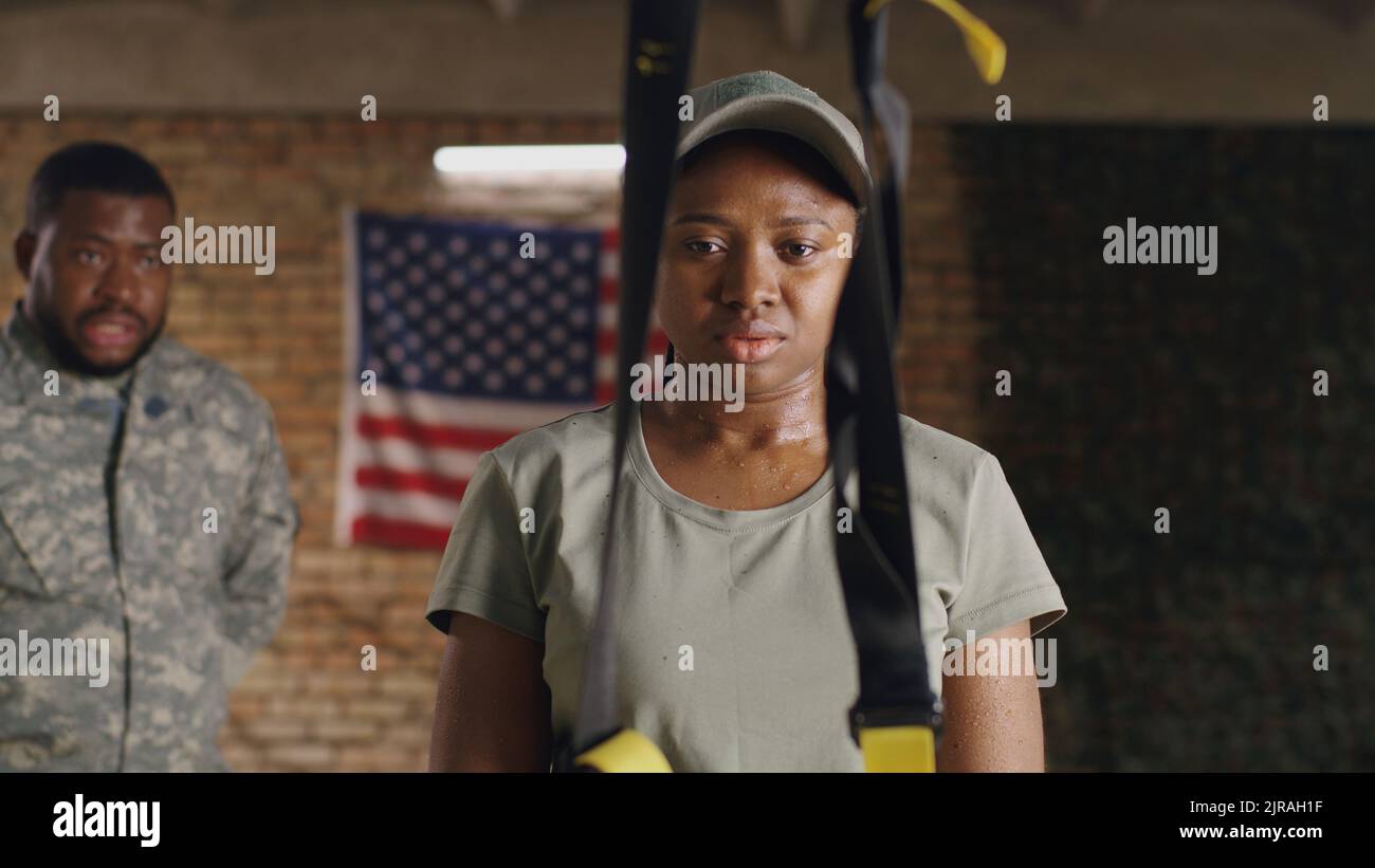African American female soldier breathing and listening to male ...