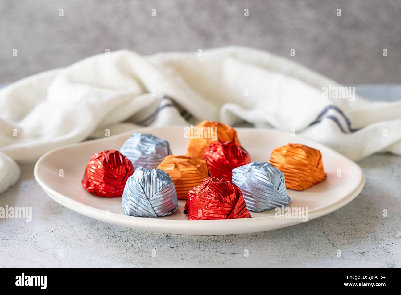 Special chocolate or gilded chocolate. Chocolates covered on gray ...
