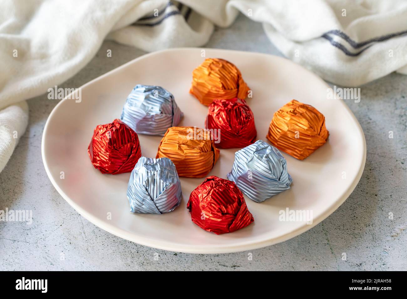 Special chocolate or gilded chocolate. Chocolates covered on gray ...