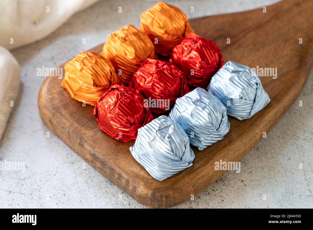 Special chocolate or gilded chocolate. Chocolates covered on gray ...