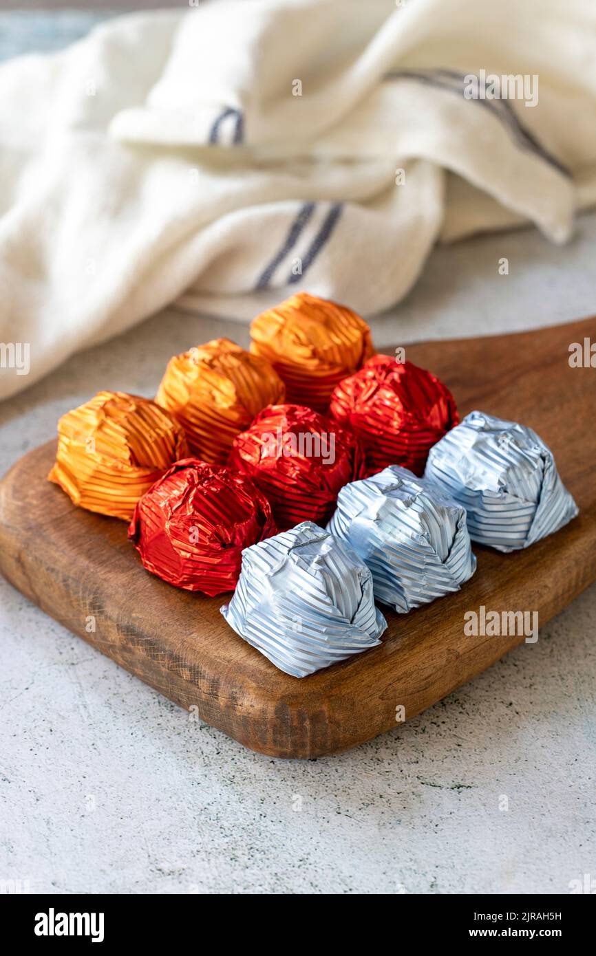 Special chocolate or gilded chocolate. Chocolates covered on gray ...