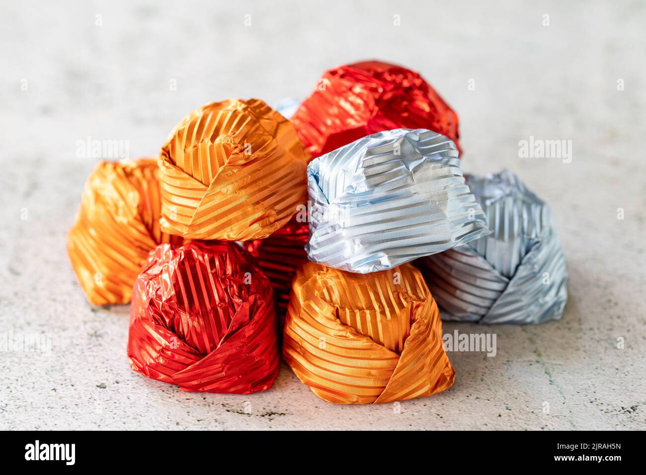 Special chocolate or gilded chocolate. Chocolates covered on gray ...