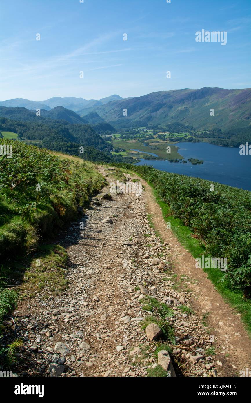 Vertical image of a stone path through the Lake district mountains past ...