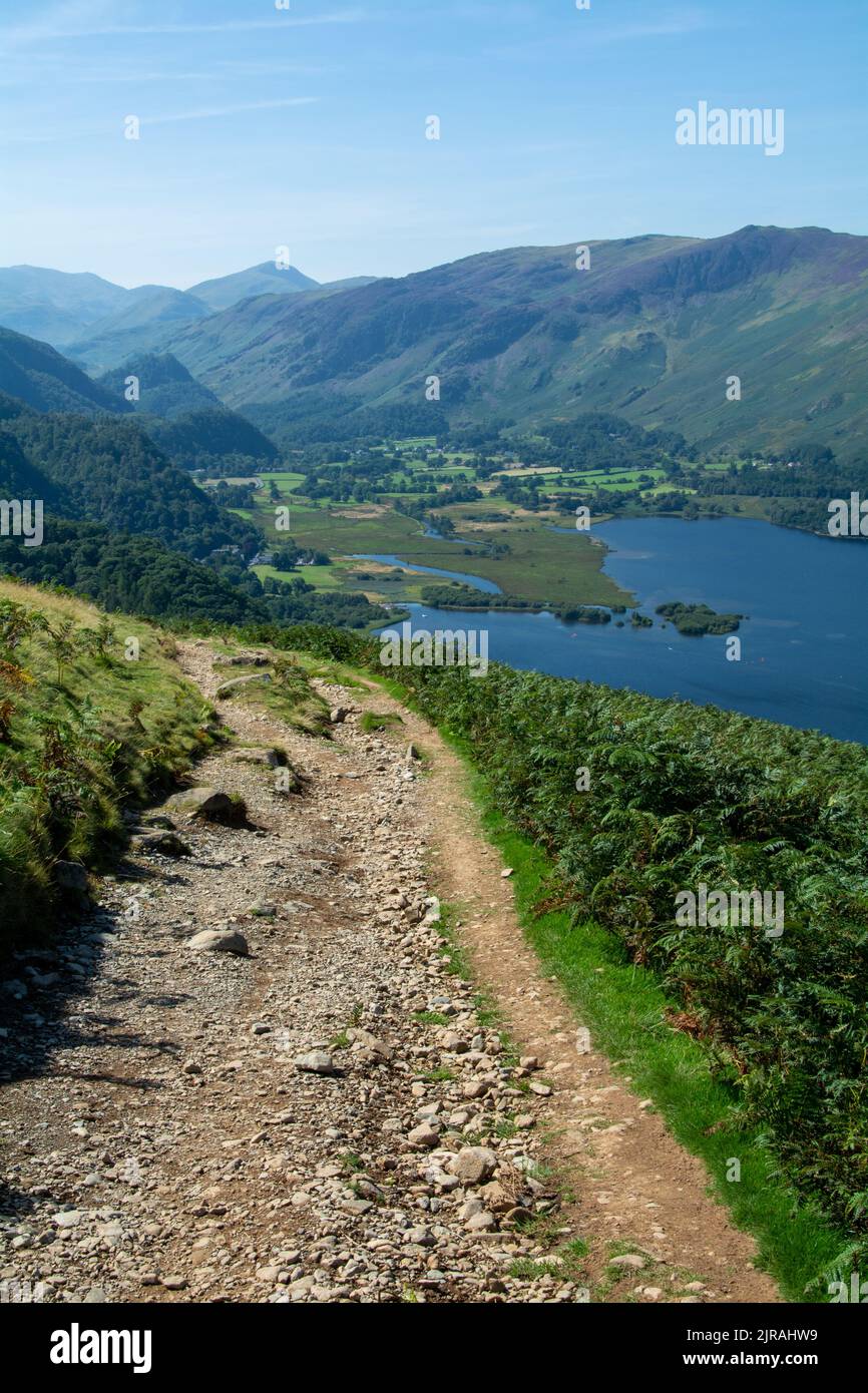 Vertical image of a stone path through the Lake district mountains past ...