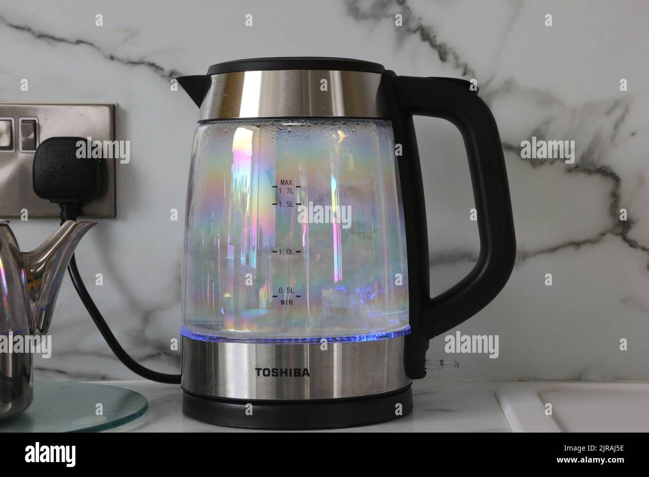 An Electic Kettle on kitchen work surface with wather being boiledThe ...