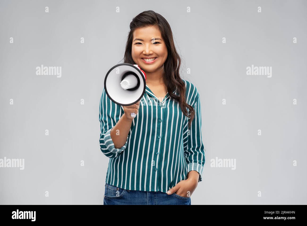happy smiling asian woman speaking to megaphone Stock Photo - Alamy