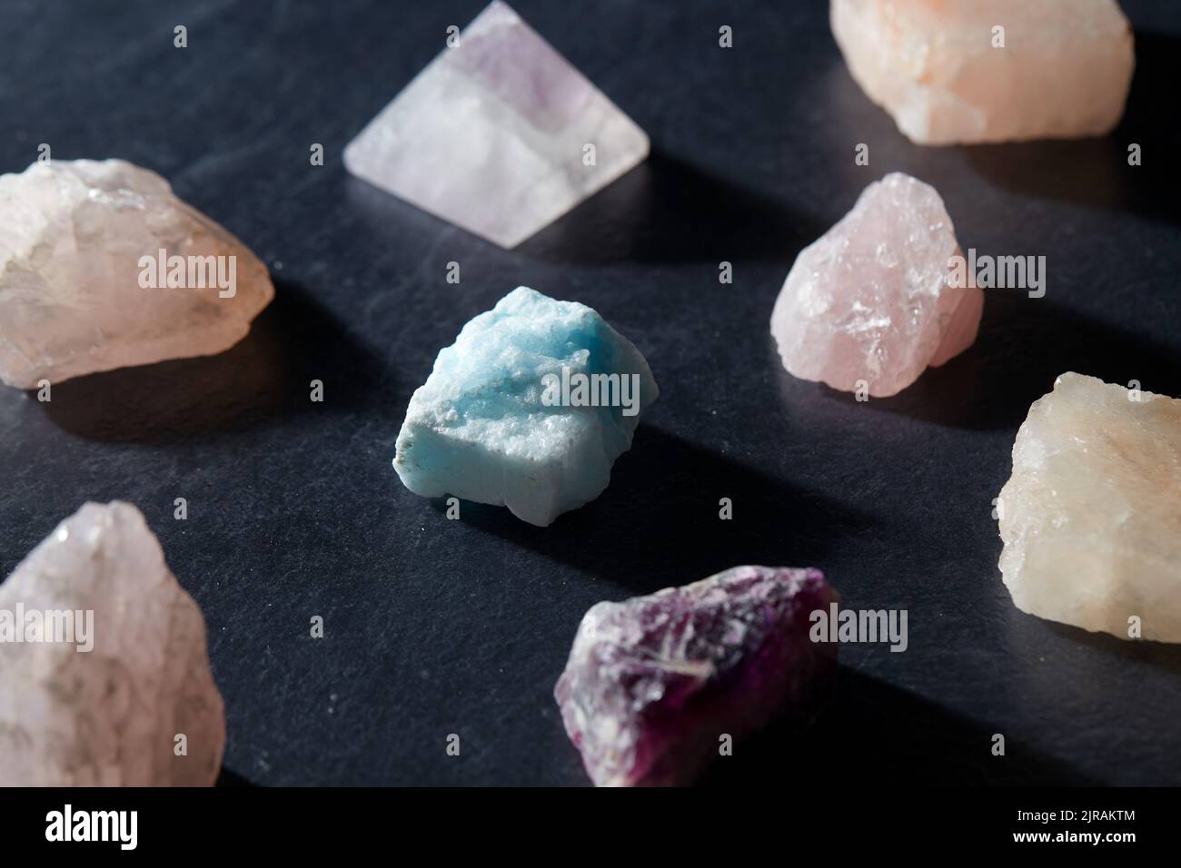 quartz crystals and gem stones on slate background Stock Photo - Alamy
