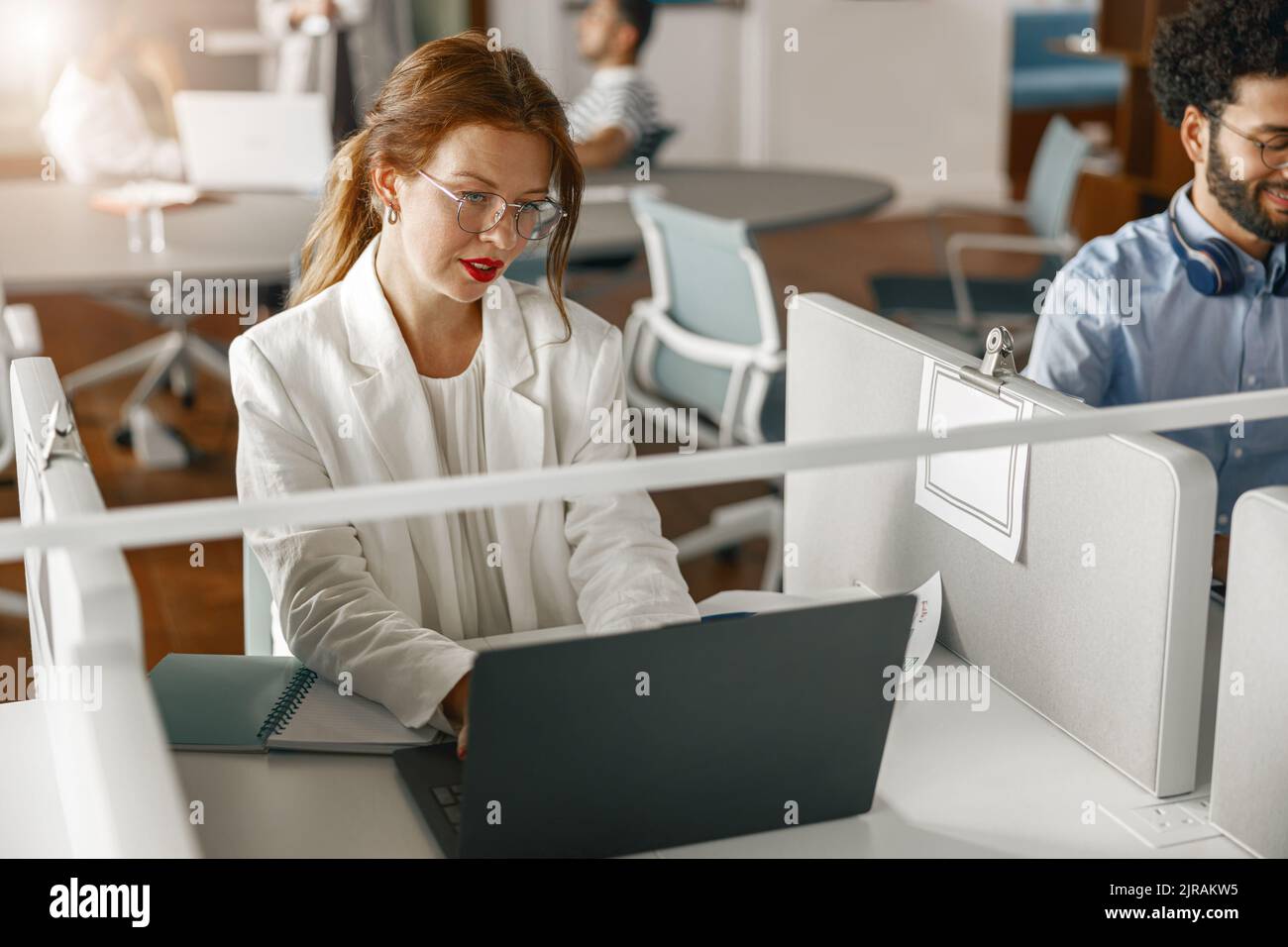 Group of diverse coworkers analyzing sales report while working ...