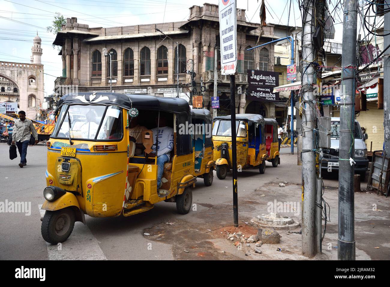 Parked autos on the streets near Charminar in the old city of Hyderabad ...