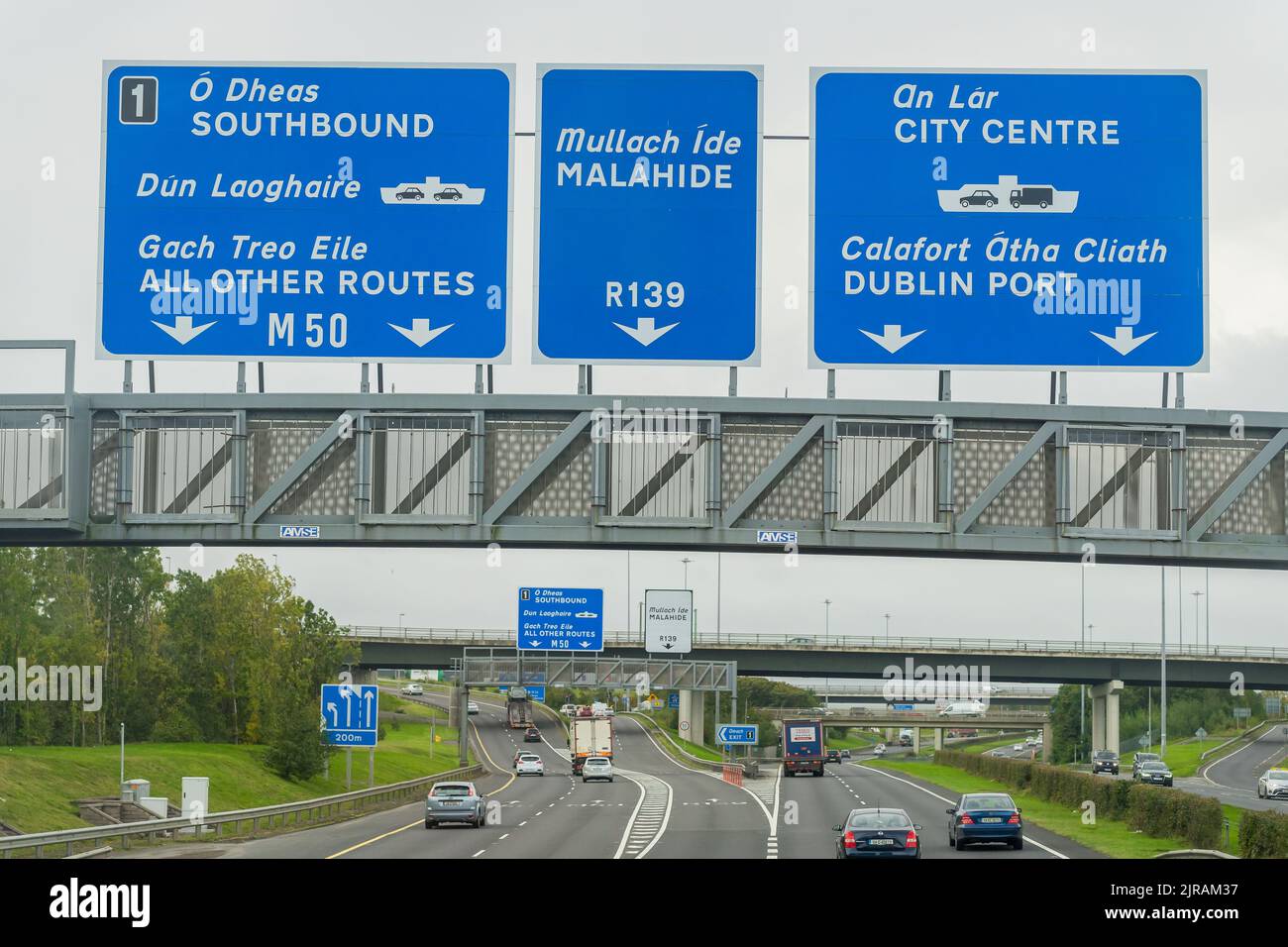 Road signs over a motorway giving traffic directions, taken at Dublin ...