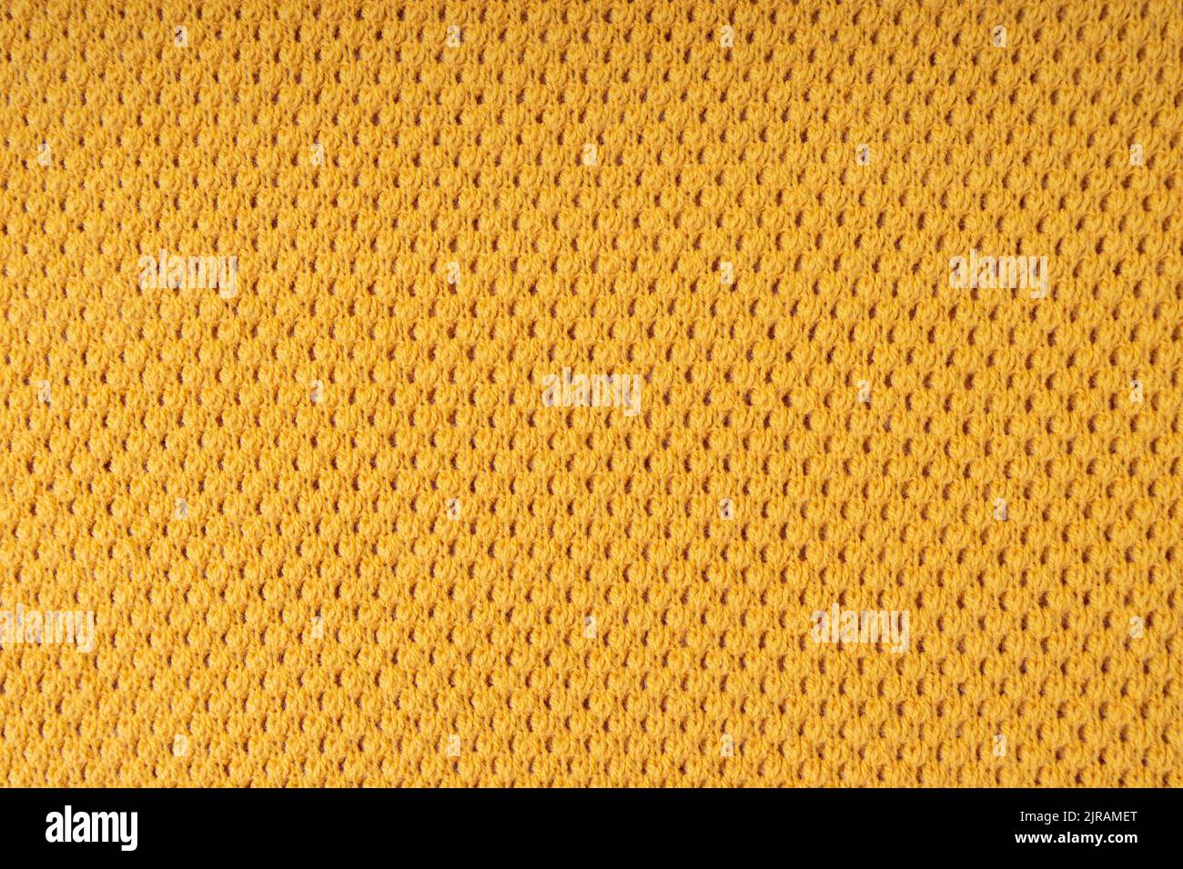 Yellow color knitting wool texture. Close up background of knitted ...