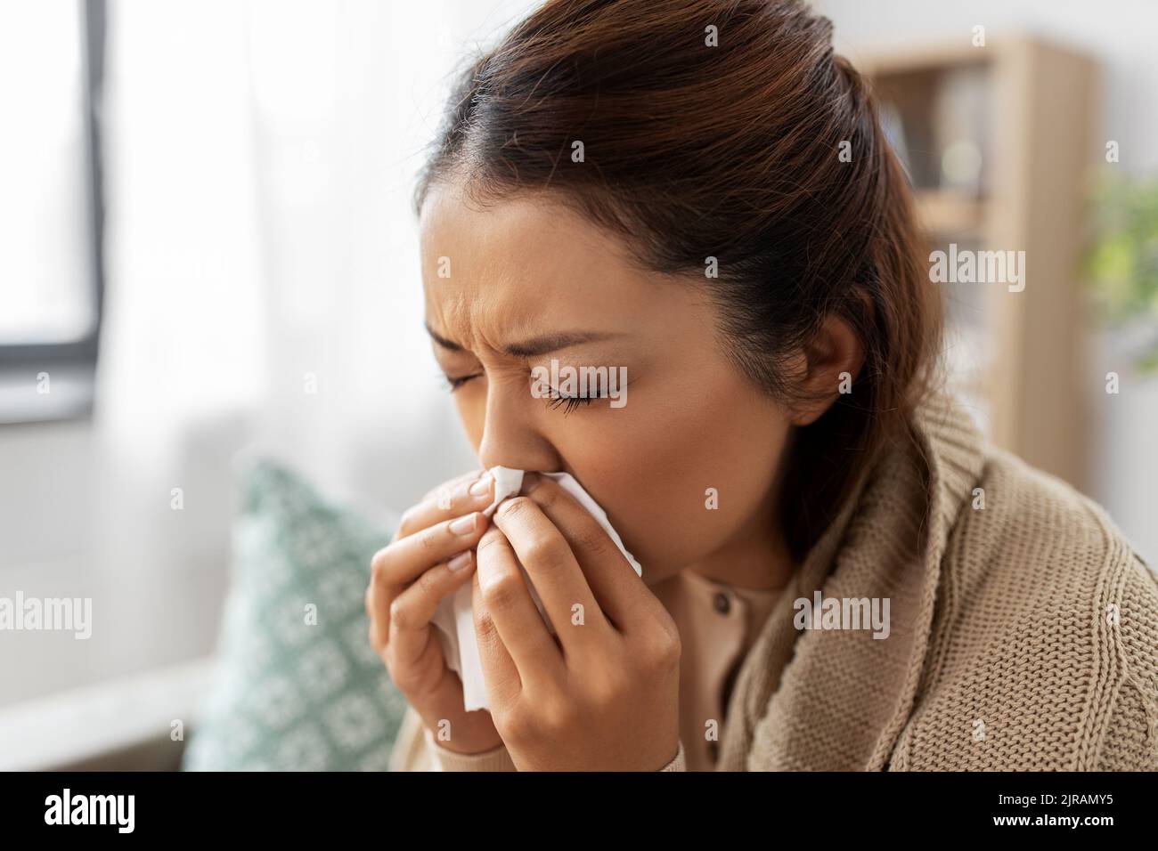 Asian woman blowing nose hi-res stock photography and images - Alamy