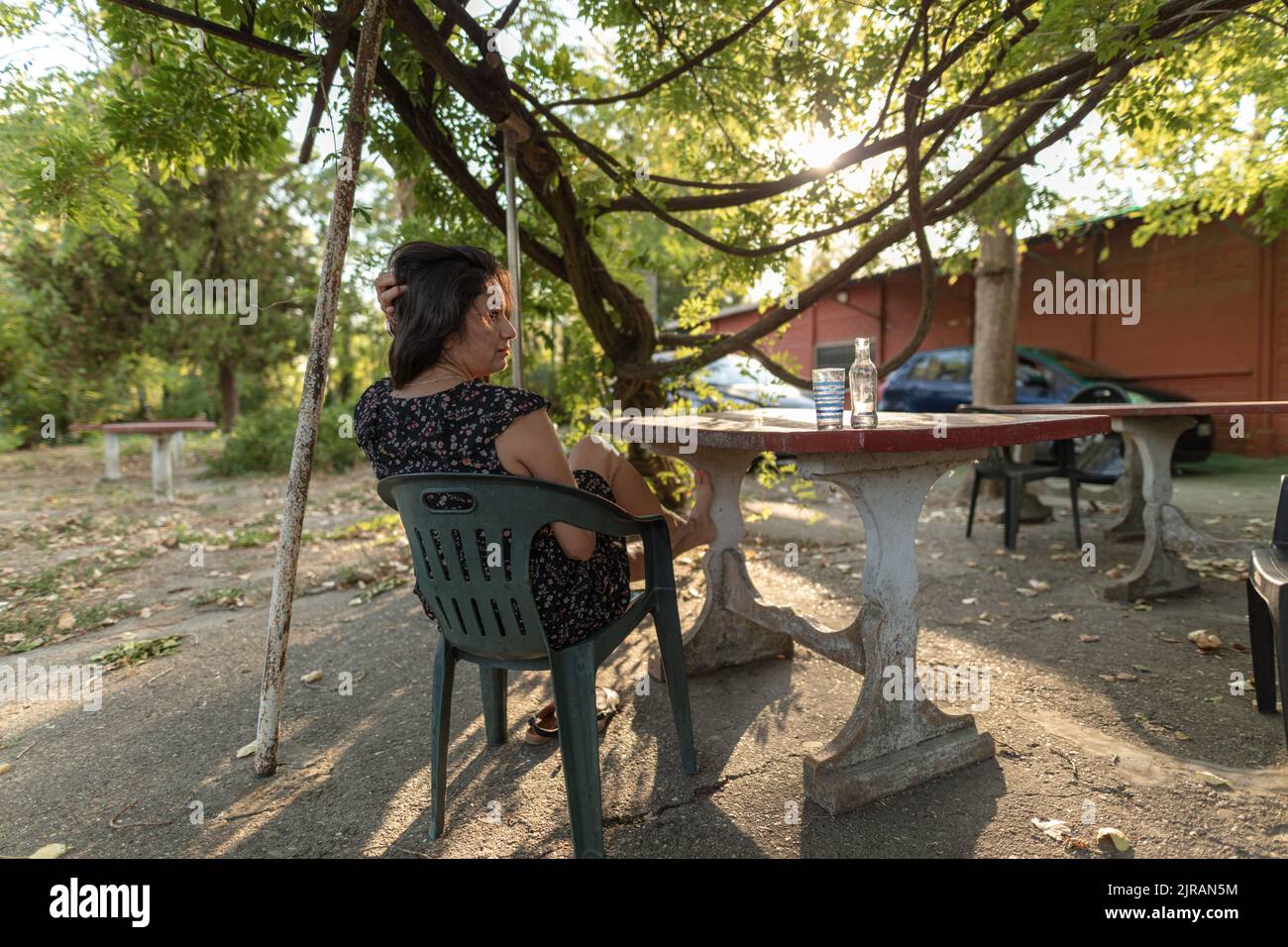 young adult latino woman drinking beer outdoors Stock Photo - Alamy