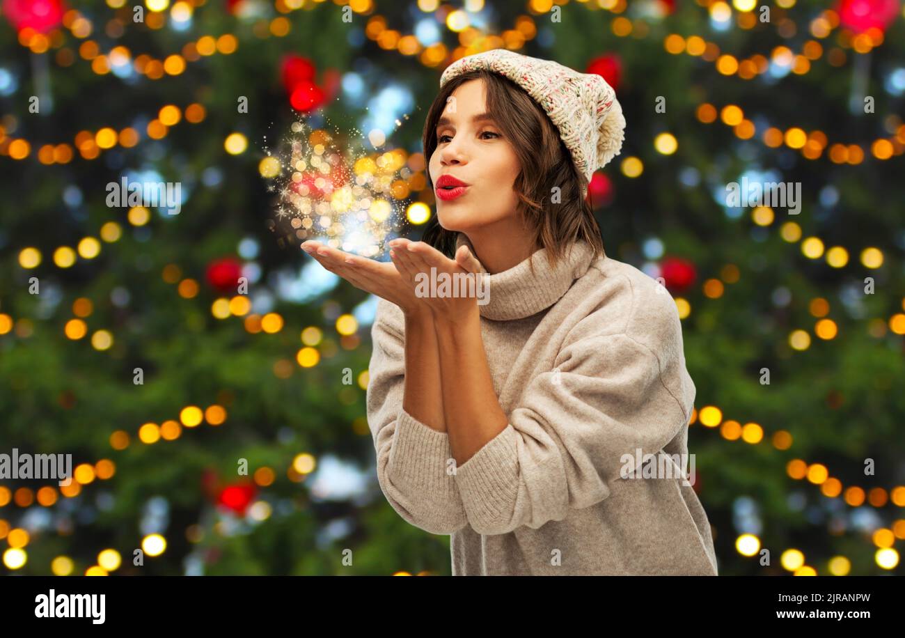 Young Woman Blowing Magic Dust with Stars from her Hands Stock Photo ...