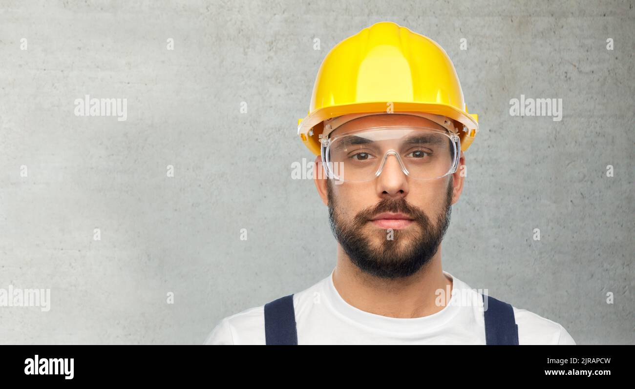 Construction worker with overall and helmet hi-res stock photography ...