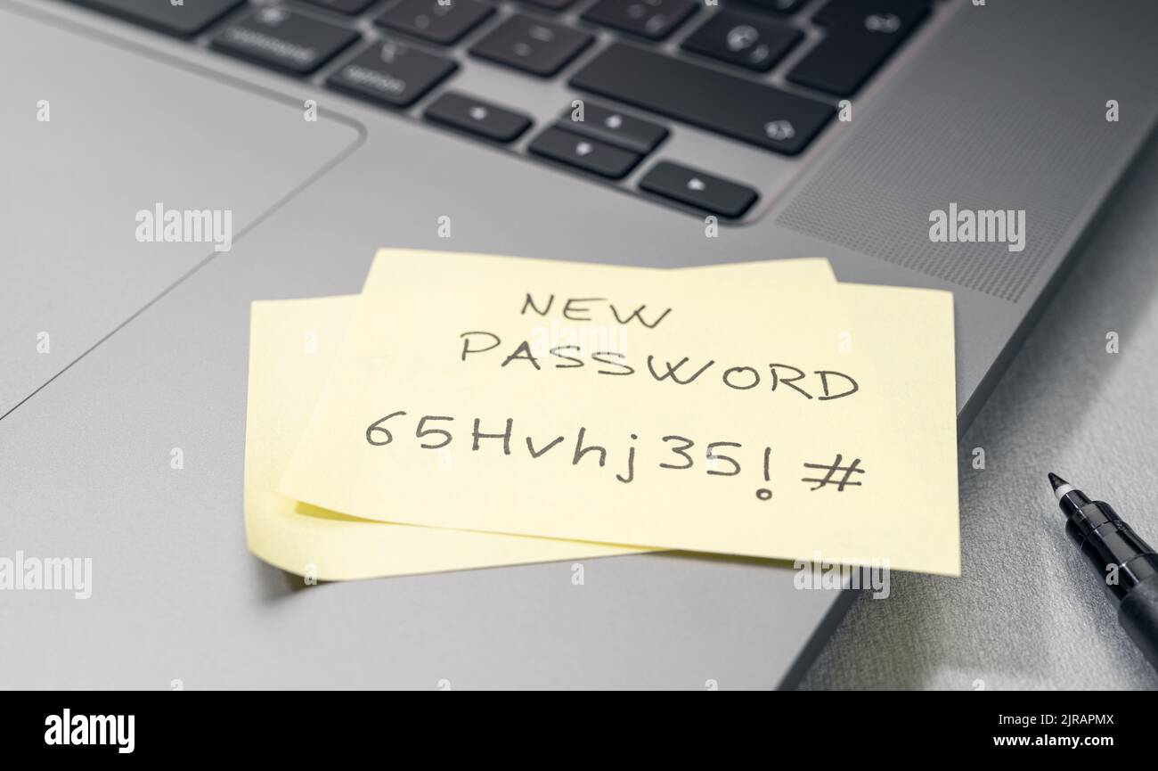 Change of password to a stronger one- Message on sticky note on laptop ...
