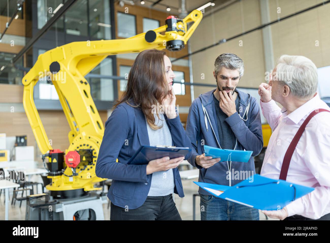 Female engineers having meeting factory hi-res stock photography and images - Alamy
