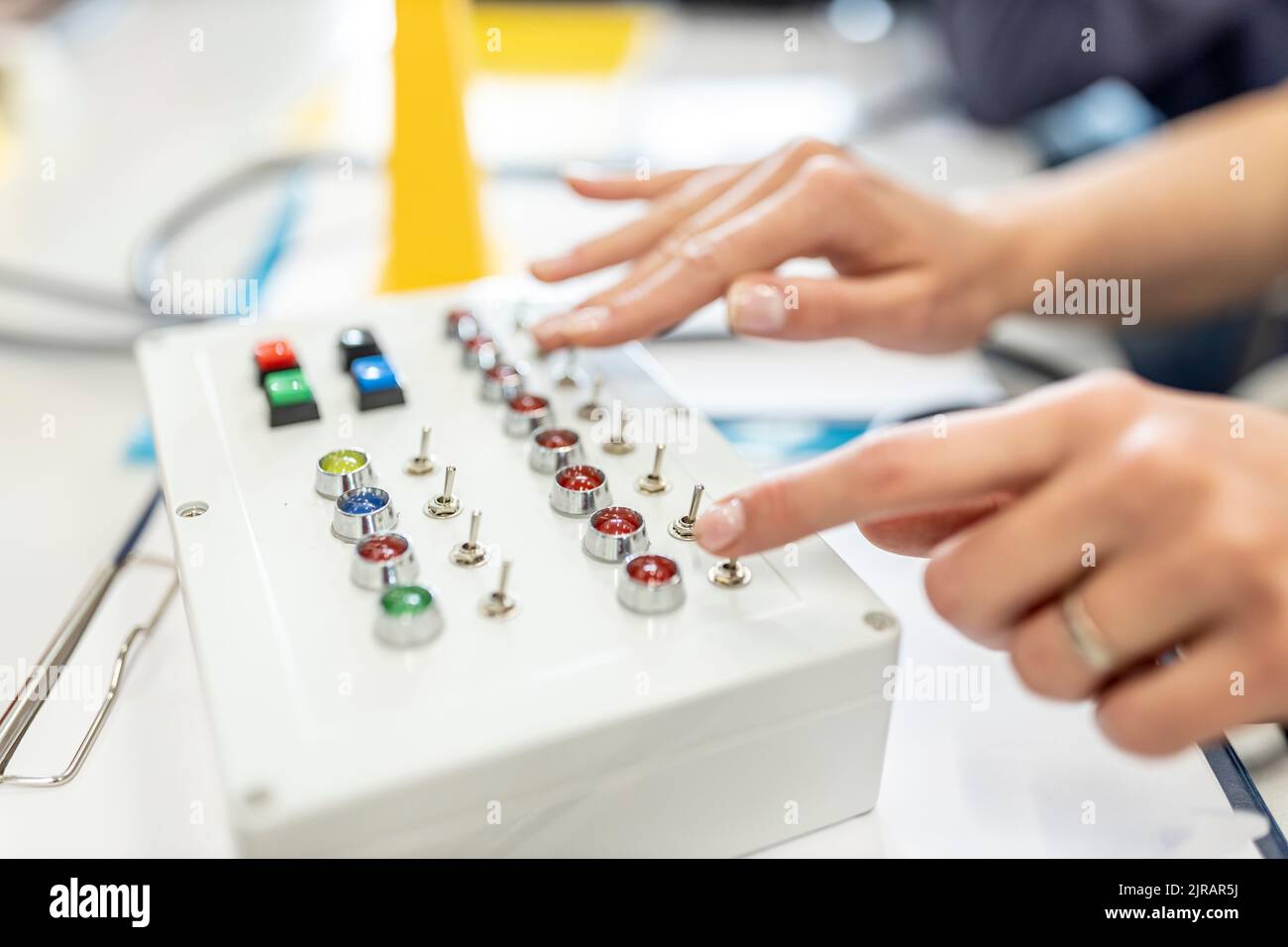 Hands of woman using switch box in industrial factory Stock Photo - Alamy