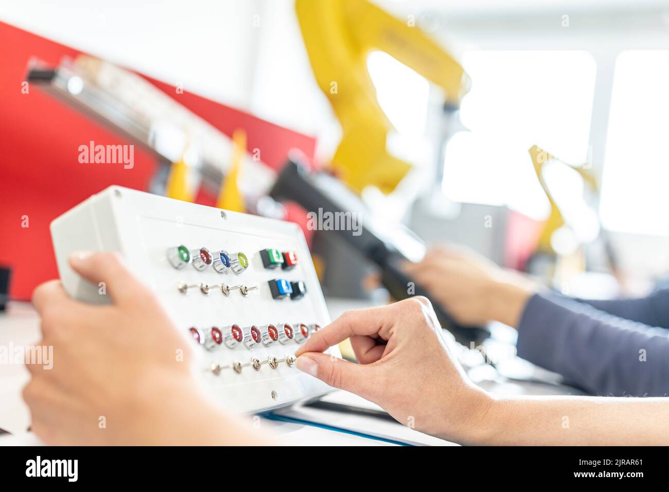 Hands of woman using switch box in industrial factory Stock Photo - Alamy