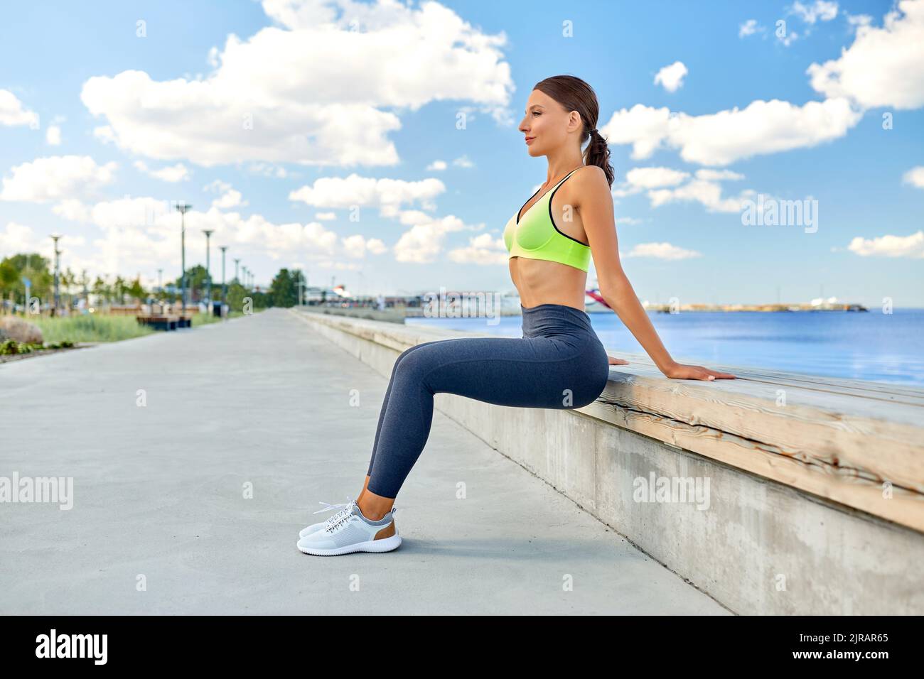 happy young woman doing sports on sea promenade Stock Photo - Alamy
