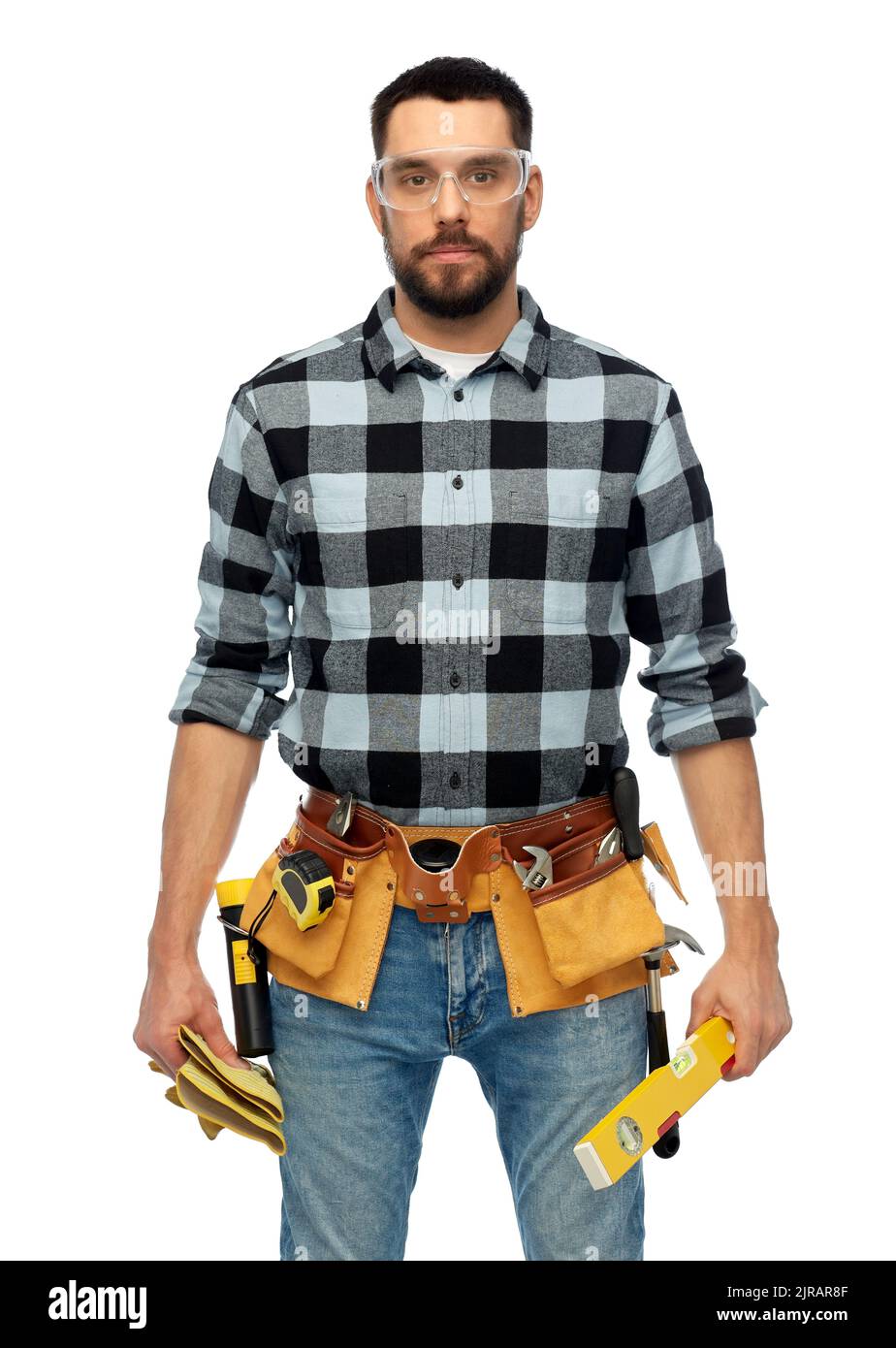 male worker or builder with tools and level Stock Photo - Alamy