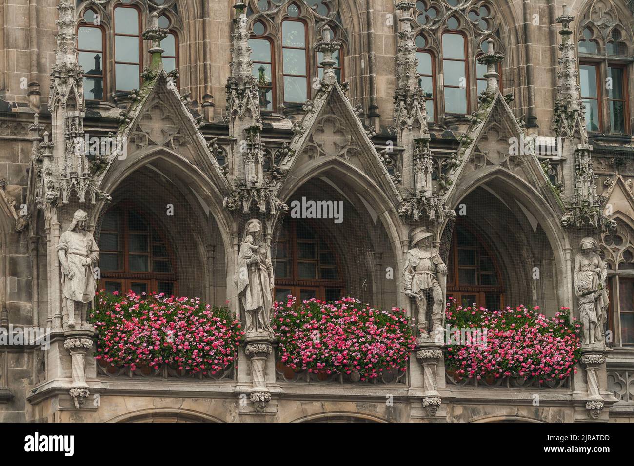 Historic medieval style buildings with flower pots at Marienplatz ...