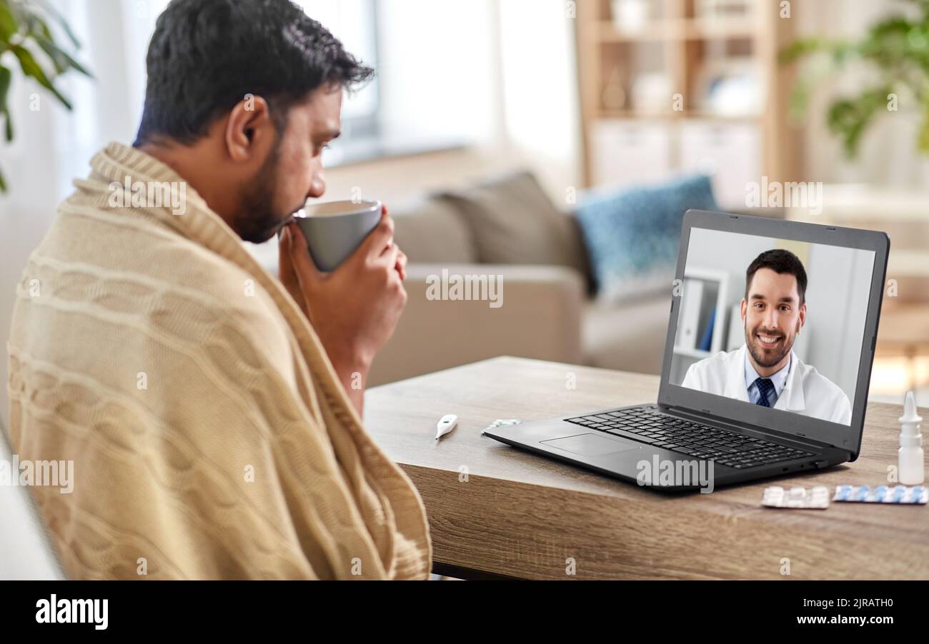 sick man having video call with doctor at home Stock Photo - Alamy