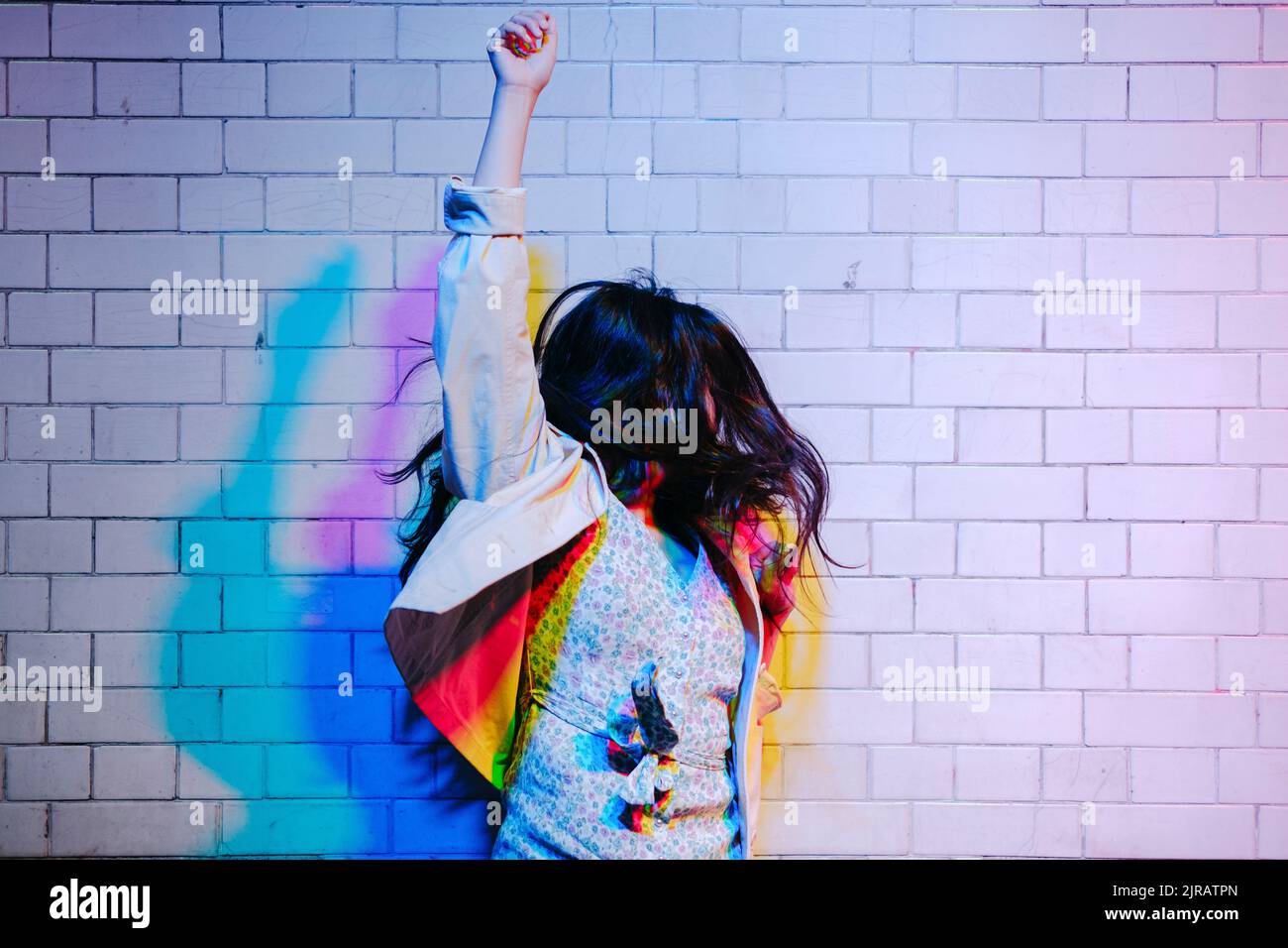 Joyful woman raised arm hi-res stock photography and images - Alamy