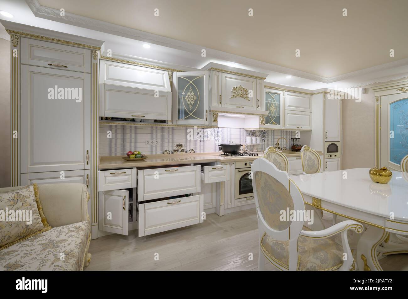 Renovated Interior of rich classic white kitchen Stock Photo - Alamy
