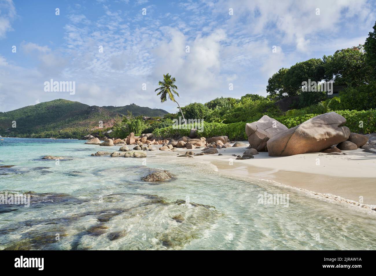 Seychelles, Praslin, Boulders lying along tropical beach Stock Photo ...