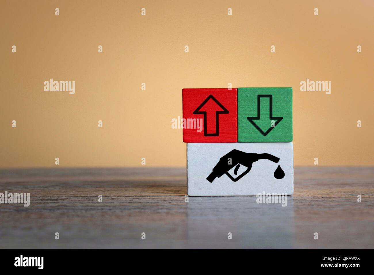 Wooden cubes with upward, downward and petrol gas fuel nozzle icon ...