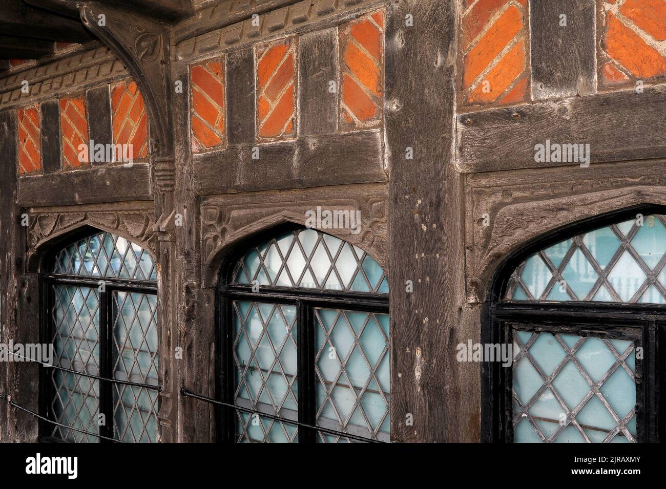 Ancient sculpted oak arches, now filled by lattice windows, used to ...
