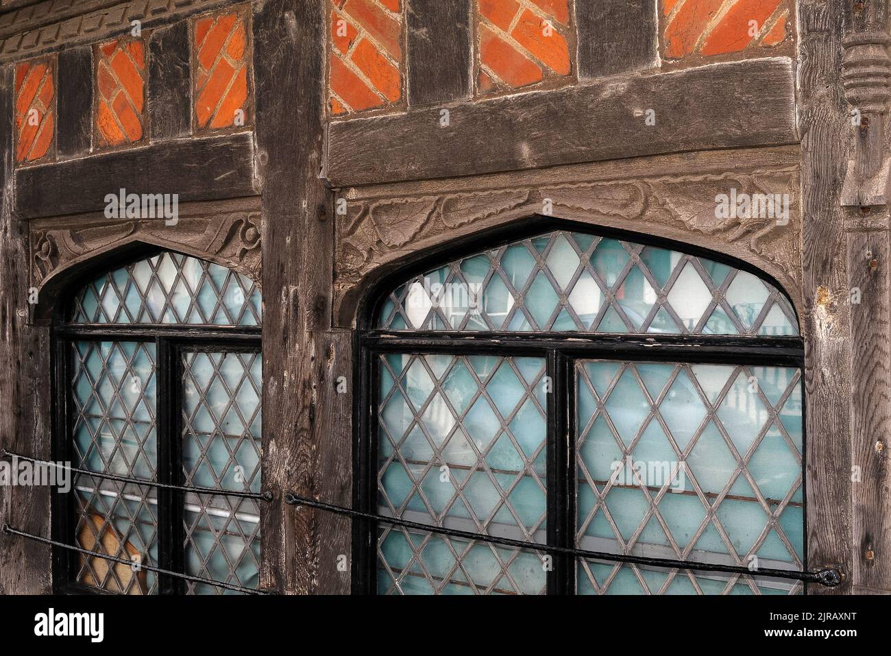 Ancient carved oak arches, now filled by lattice windows, used to lead ...