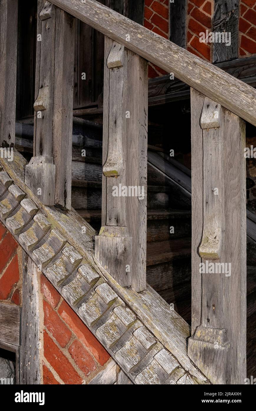 Oak balustrade of external timber-framed staircase leading to the upper ...
