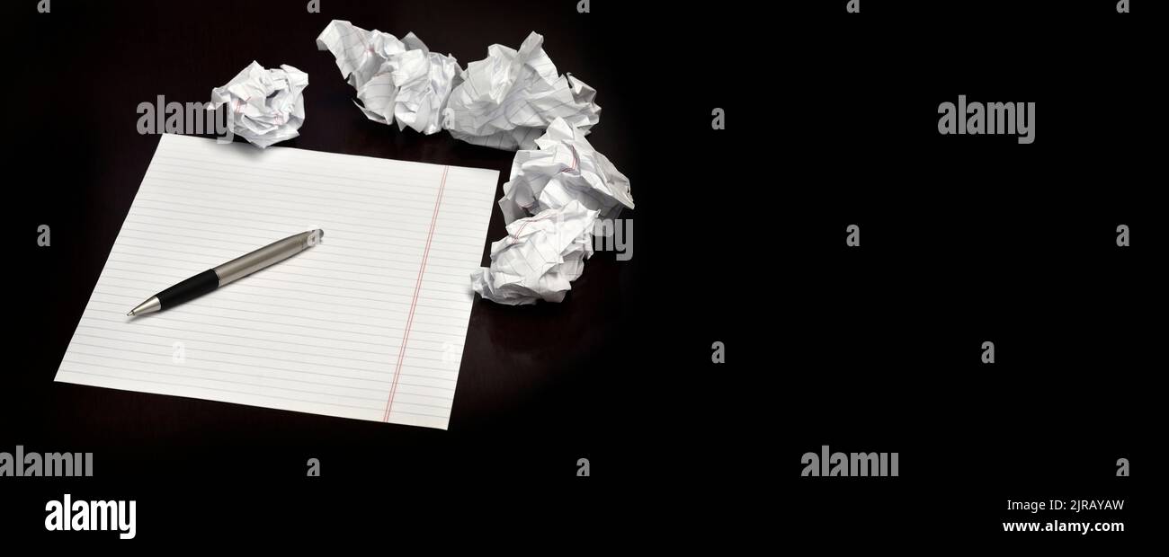 Pen and paper on a desk with discarded trashed ideas written ouit Stock ...