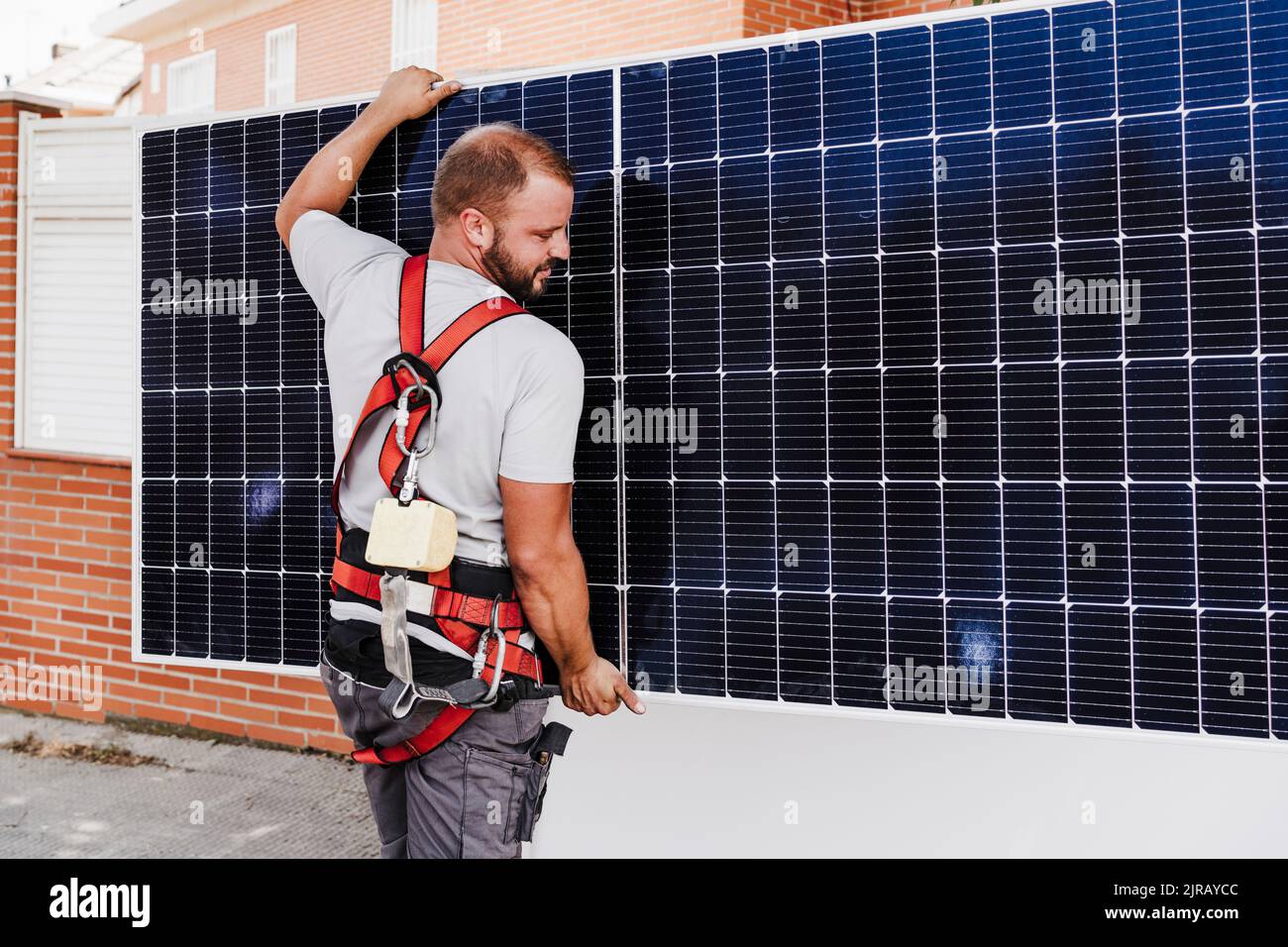 Man carrying solar panel hi-res stock photography and images - Alamy