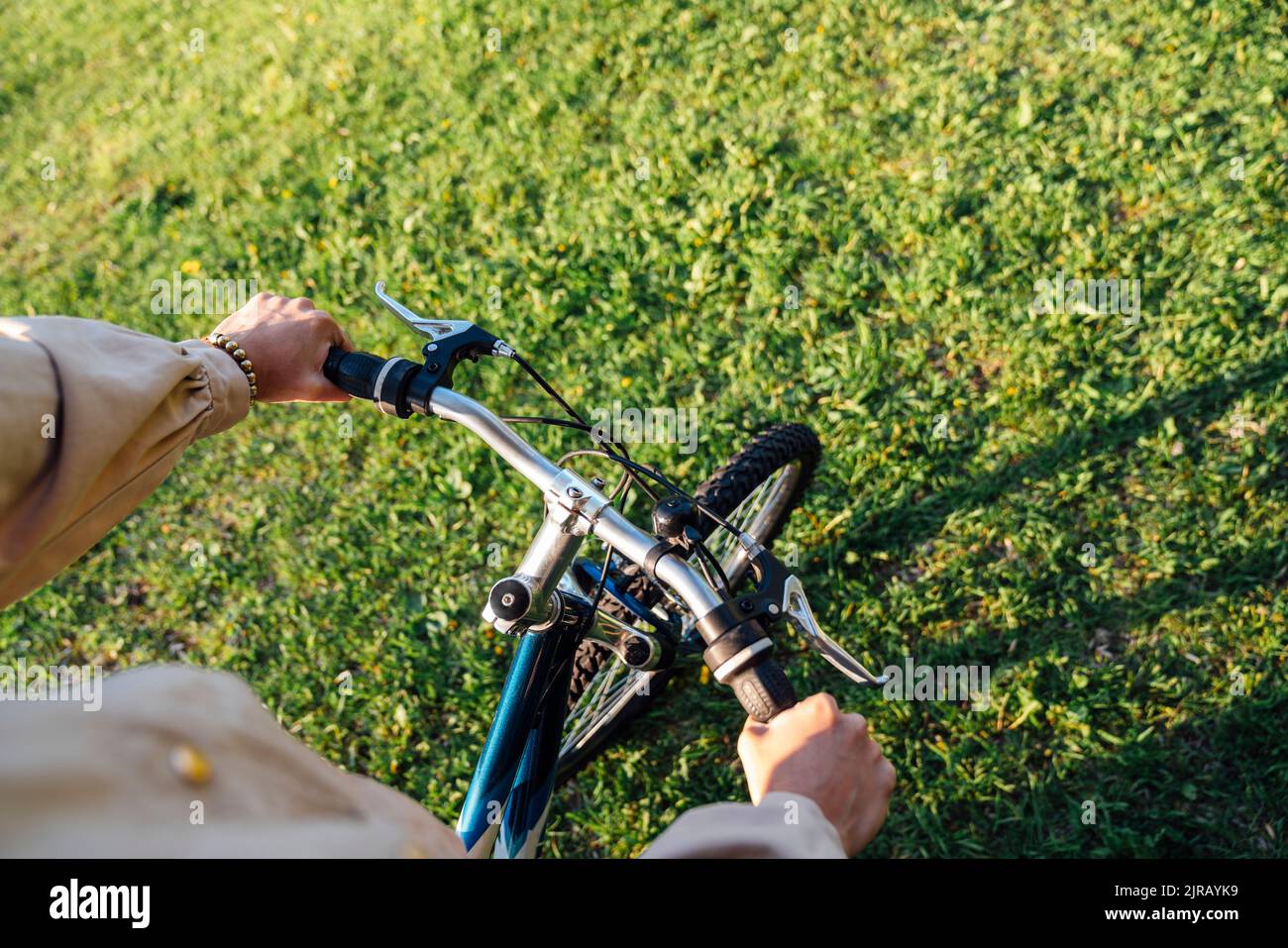 Hands holding handlebar bicycle hi-res stock photography and images - Alamy