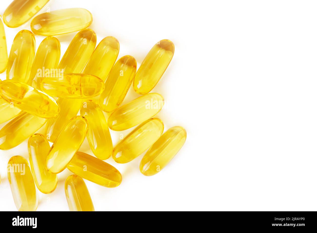 Pile of softgels capsules Omega 3 isolated on white background. Close ...