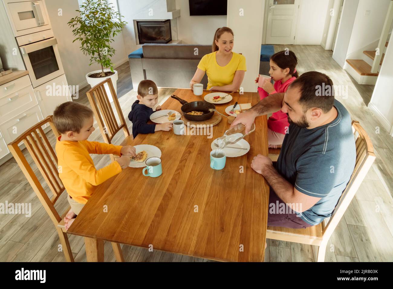 Family having breakfast at home Stock Photo - Alamy