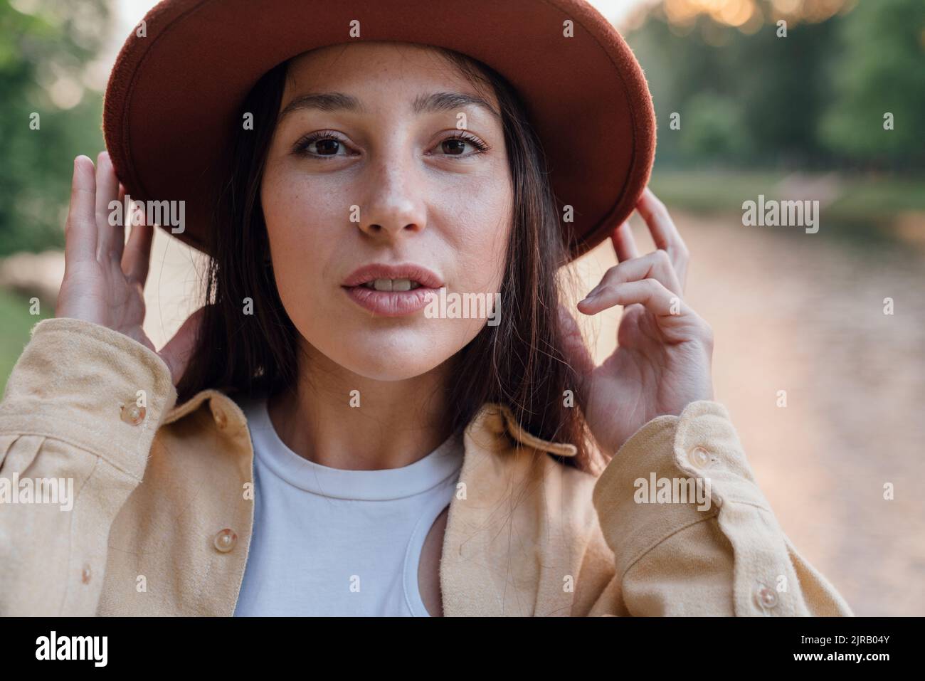 Adjusting hat hi-res stock photography and images - Alamy