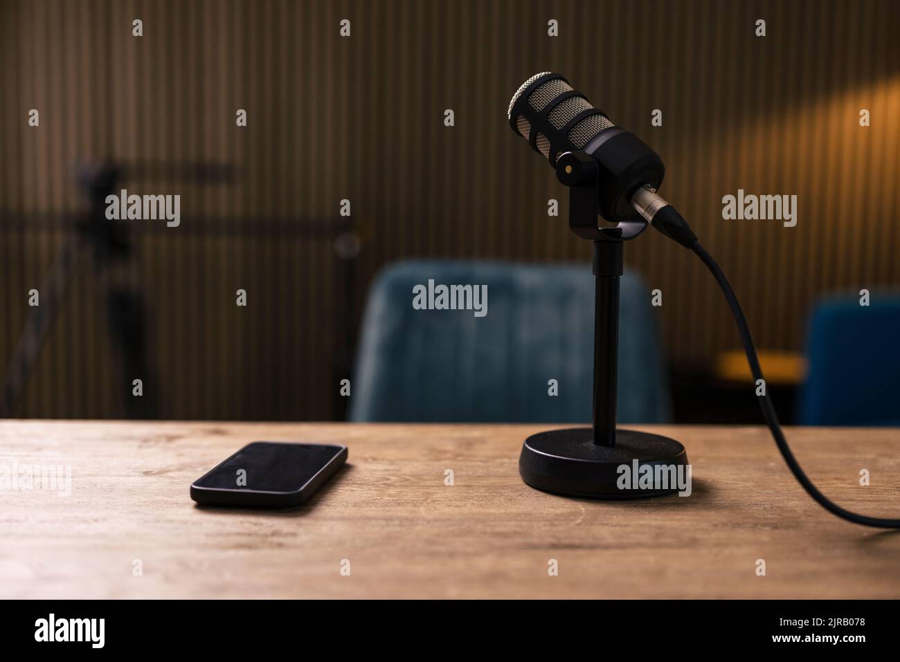 Smart phone by microphone on desk in recording studio Stock Photo - Alamy