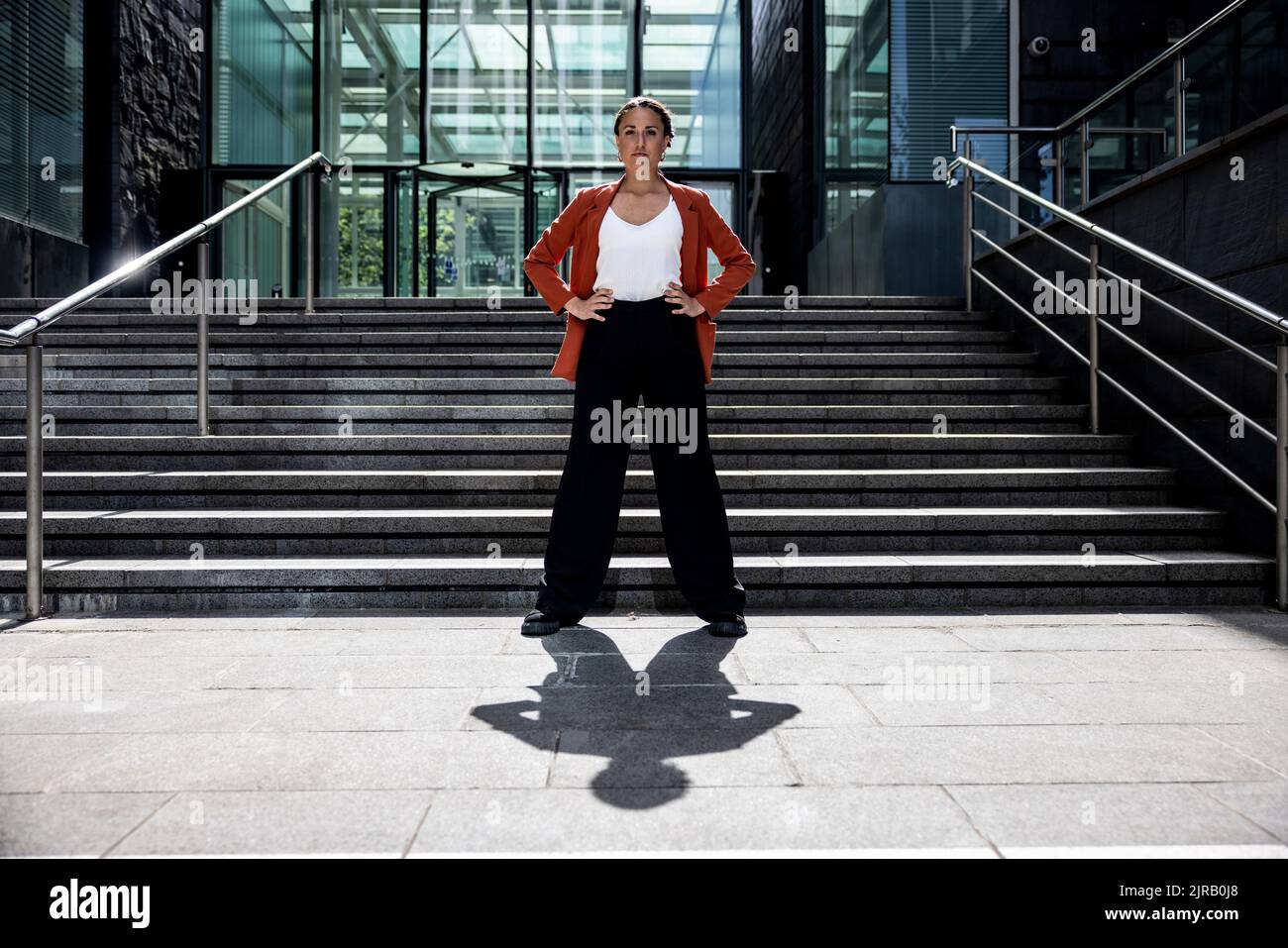 Business people with arms akimbo hi-res stock photography and images ...