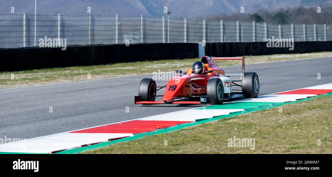 Formula race red car action on racetrack. Mugello, Italy, march 25 2022 ...
